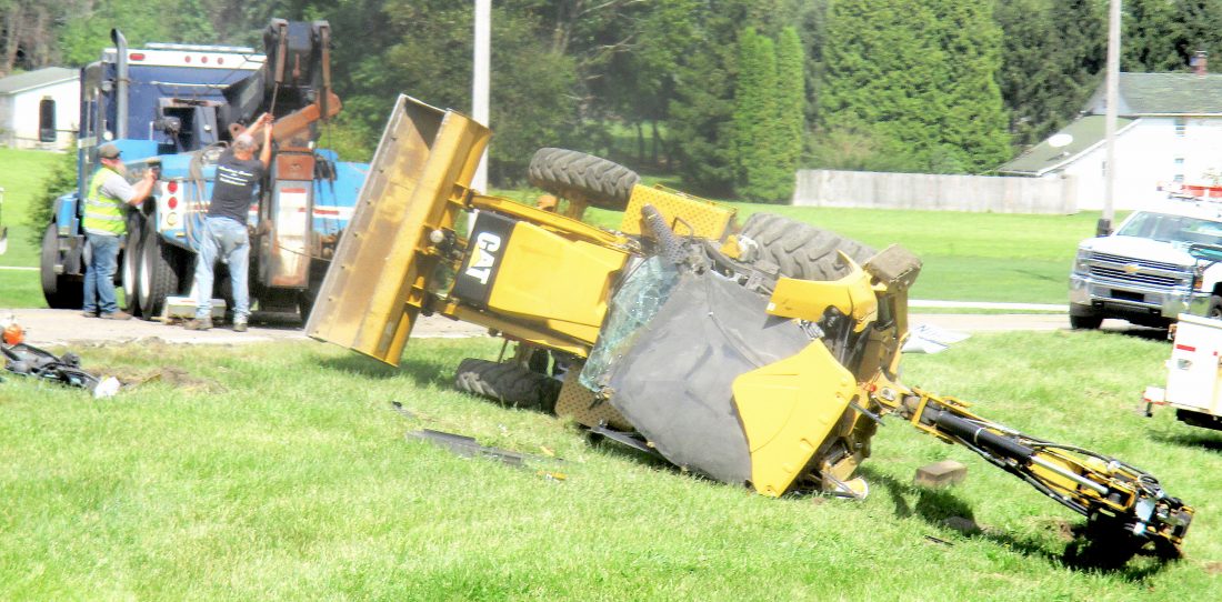 Tractor takes a tumble | News, Sports, Jobs - Salem News